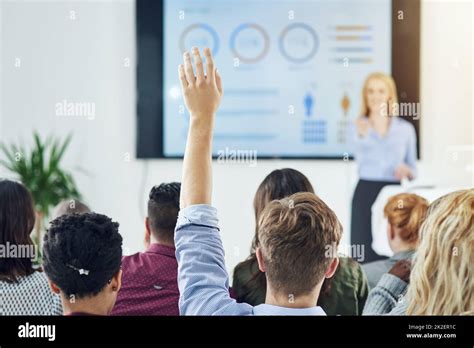 Raise Your Hands For Learning Opportunites Shot Of A Group Of