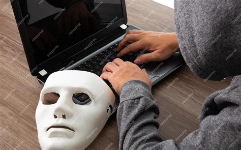 Premium Photo Thief Hacker In Mask Stealing Personal Information From
