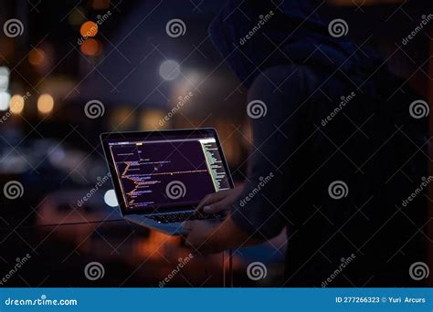 Is Your Data In Safe Hands An Unrecognisable Hacker Using A Laptop In The Dark Stock Image