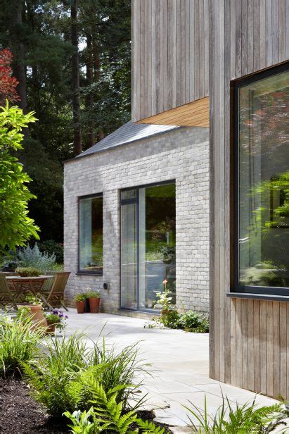 Alma Nac Slots Angular Openings Into Timber Clad Gables Of House In The