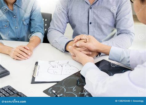Patient Being Reassured Desperate Holding Hand By Doctor Encouraging