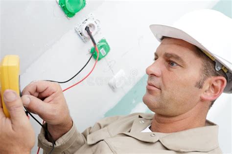 Close Up Male Technician Doing Meter Reading Using Mobilephone Stock