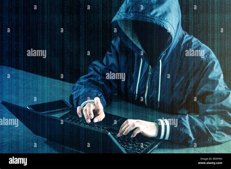 Anonymous Hacker Programmer Uses A Laptop To Hack The System Stealing Personal Data Creation