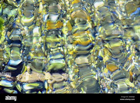 Diffraction And Refraction Of Light In Water On A Coloured Background Stock Photo Alamy