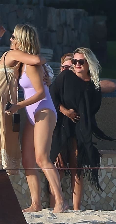 Molly Sims Slips Into A Lavender Swimsuit For A Fun Day At The Beach In Cabo Photos