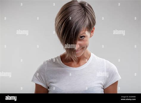 Cute Woman Peeking Out From Under Her Fringe Stock Photo Alamy