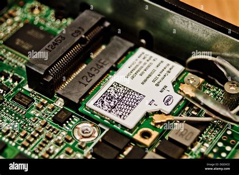 A Mini PCIe Wireless Network Card Adapter WiFi Connected To An Antenna Via The Cables Shown