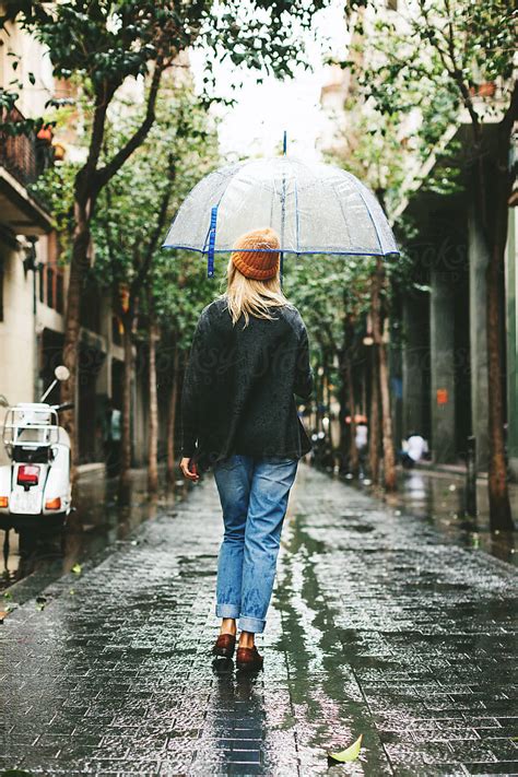 Girl Walking In The Rain With Umbrella