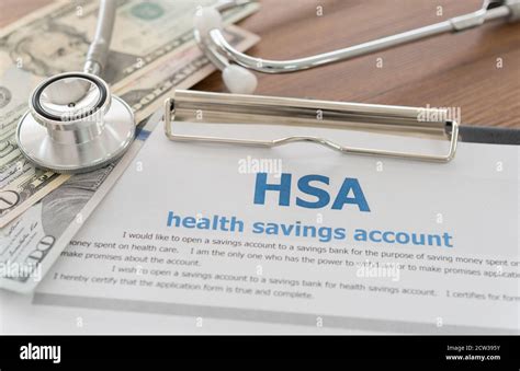 Health Savings Account Hsa Concept With Application Form Dollar Money Stethoscope On Desk Stock