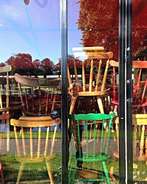Premium Photo Chair Stack Seen Through Window