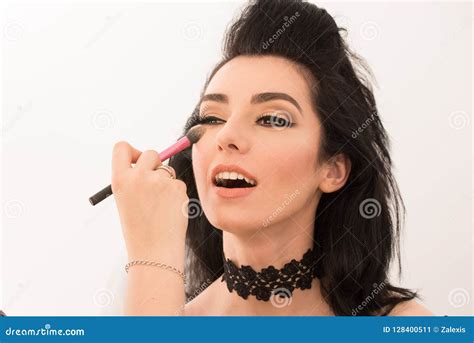 Sensual Brunette Model Retro Styled During Makeup Retouch On White Background Stock Image