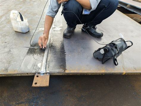 Inspectors Are Checking Defects In Welded Steel Plate Add Joints With Process Ultrasonic Testing