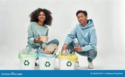 Smiling Couple Sort Garbage In Different Dustbins Stock Image Image