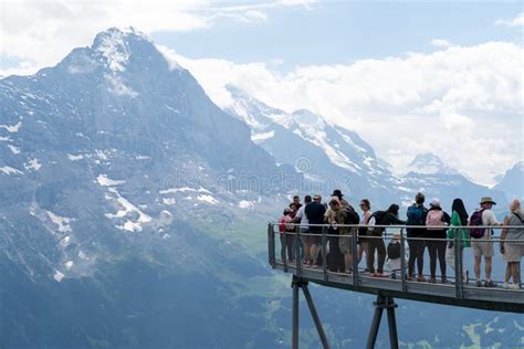 Tourists Walk On The Grindelwald First Cliff Walk In Switzerland In The