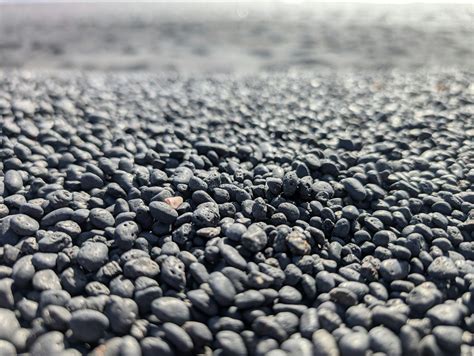 A Close Up View Of Many Small Dark Pebbles Photo Free Lanzarote