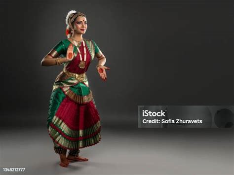 Beautiful Woman Dressed In A Traditional Indian Dance Suit Is Shows