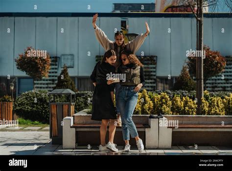 Beautiful Girls Hanging Out On A Beautiful Sunny Day They Are Taking A