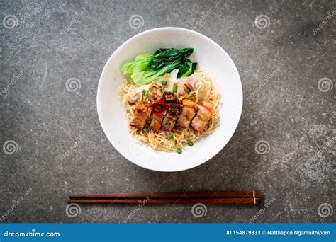 Egg Noodle Soup With Crispy Pork Belly And Wonton Stock Image Image