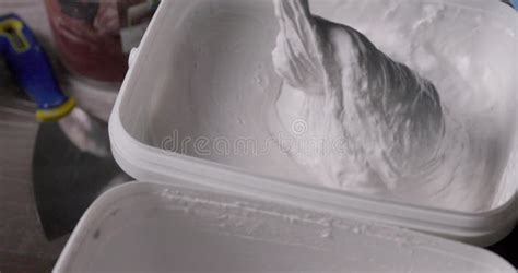 A Smooth And Creamy White Substance Placed Inside A Container For