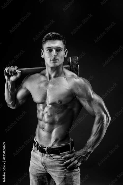 Muscular Man With Naked Torso Holding Big Hummer Isolated On Dark Grey Background Stock Photo