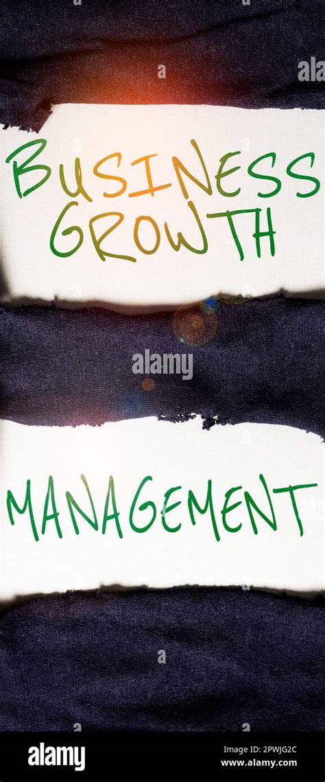 Hand Writing Sign Business Growth Management Business Overview Improving Some Measure Of An