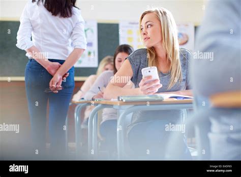 Female Babe In Classroom Cheating During An Exam Stock Photo Alamy