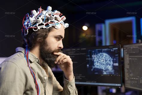 Programmer Using Eeg Headset To Upload His Mind Into Computer Stock