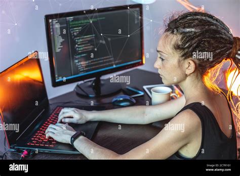 Modern Young Female Programmer Is Writing Program Code On A Laptop At