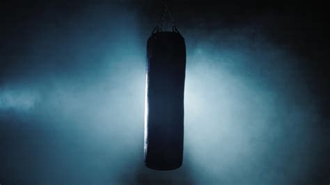 Premium Stock Video Boxing Speedbag Spotlighted In A Gym