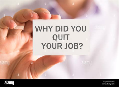 Closeup On Businessman Holding A Card With Why Did You Quit Your Job