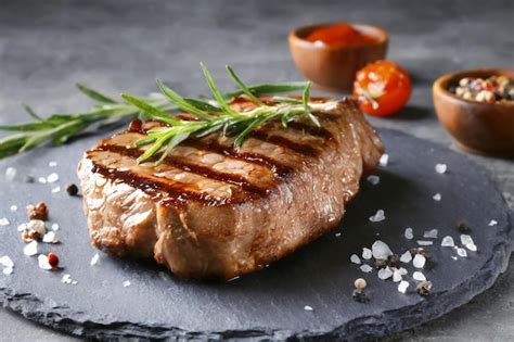 Premium Photo Ready Grilled Steak On Cutting Board