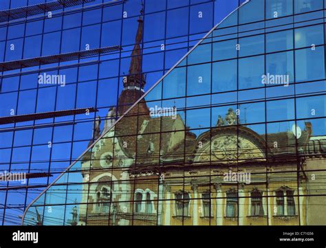 Old Window With Reflection Of The Windows Of Building Opposite Hi Res