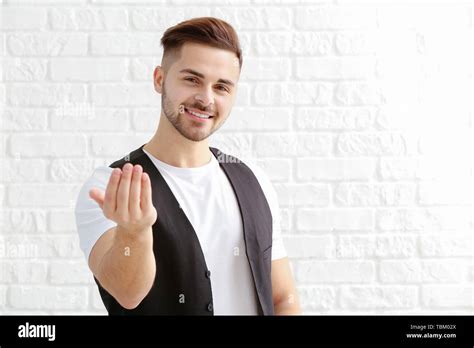 Handsome Man Showing Come Here Gesture On White Background Stock
