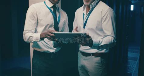 People Manager And Tablet In Server Room Programming And Engineering