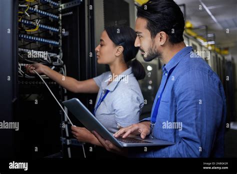 Man Woman Or Server Room Maintenance On Laptop IT Software Programming Ideas Or Cybersecurity