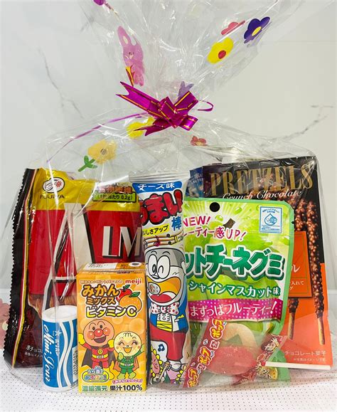 КҮМИКО Япон Багц 1 33900 1 Алмонд шоколадтай үрэл ууттай 2 Үмай чийз чипс 3 Шагшуурга 4