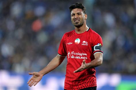 عکس شجاع خلیل‌زاده با مربی تیم ملی در مراسم یادبود شهدای خدمت خبرآنلاین