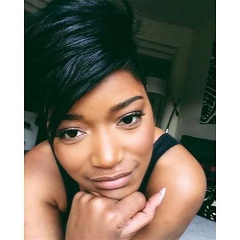 A Close Up Of A Person With Her Hand On Her Chin And Looking At The Camera