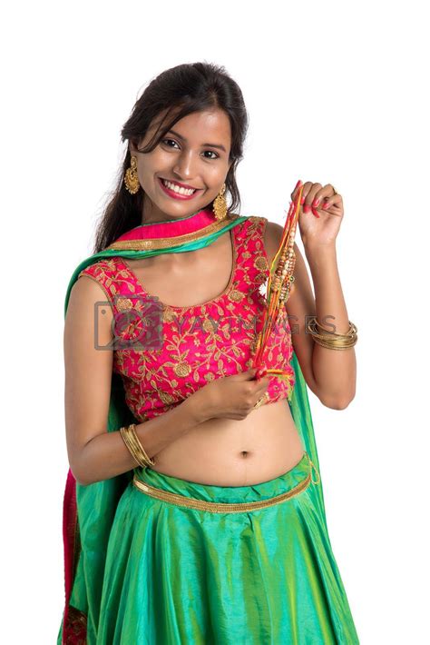 Beautiful Girl Showing Rakhi On Occasion Of Raksha Bandhan On A White