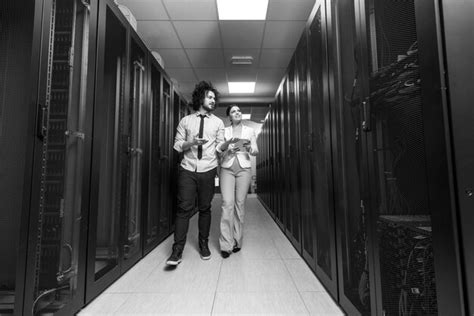 Premium Photo Young It Engineer Showing Working Data Center Server