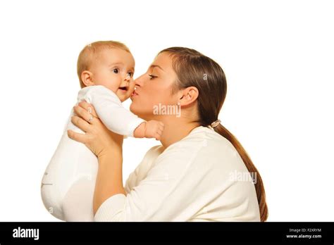 Mother Kissing Her Baby Stock Photo Alamy