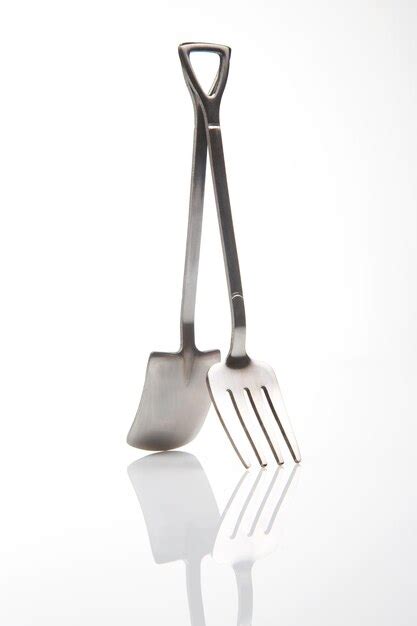 Premium Photo Decorative Fork And Spoons In The Form Of Spades On A