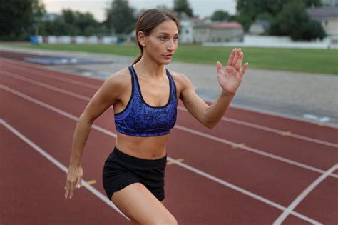 Free Photo Woman Running On Track Side View