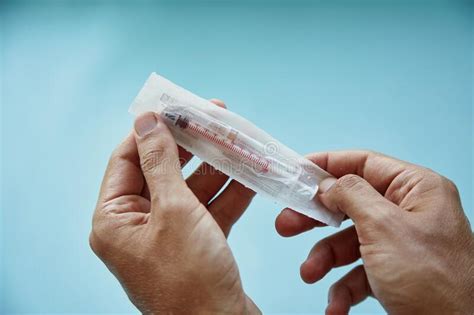 Hands Unpacking A Syringe Close Up Stock Photo Image Of Prevention