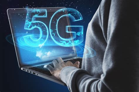 Premium Photo Hacker Hands Using Notebook With Creative Glowing Polygonal 5g Hologram On Blue