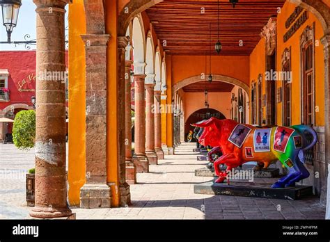 Individually Painted Statues Of Bulls Line The Portales Del Carmen