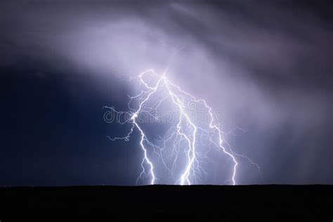 Lightning Bolt Striking In A Storm Thunderstorm In The Night Sky Stock