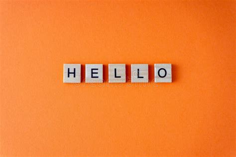 Hello Word The Phrase Is Laid Out In Wooden Letters Top View Orange Flat Lay Background Stock