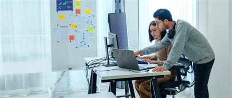 Asian And Indian Developer Team Discussion Feedback Analysis Coding Data With Software Computer