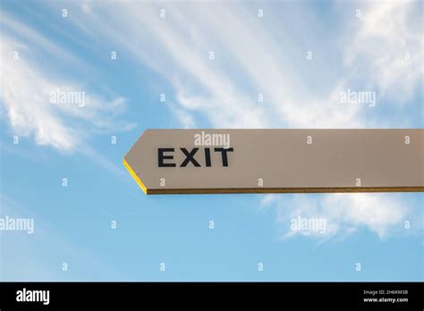 Simple Exit Sign Pointing To Left Against A Sky Stock Photo Alamy